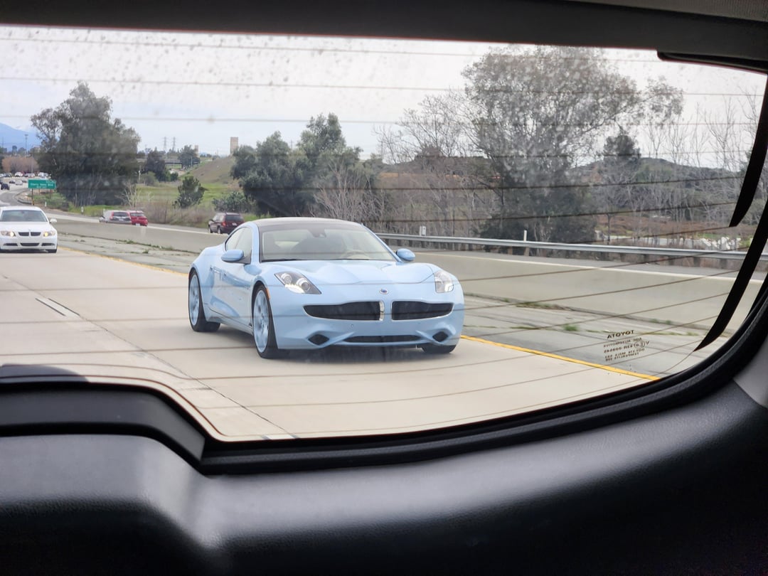 A company's first car and their newest car rollin together [Fisker ...