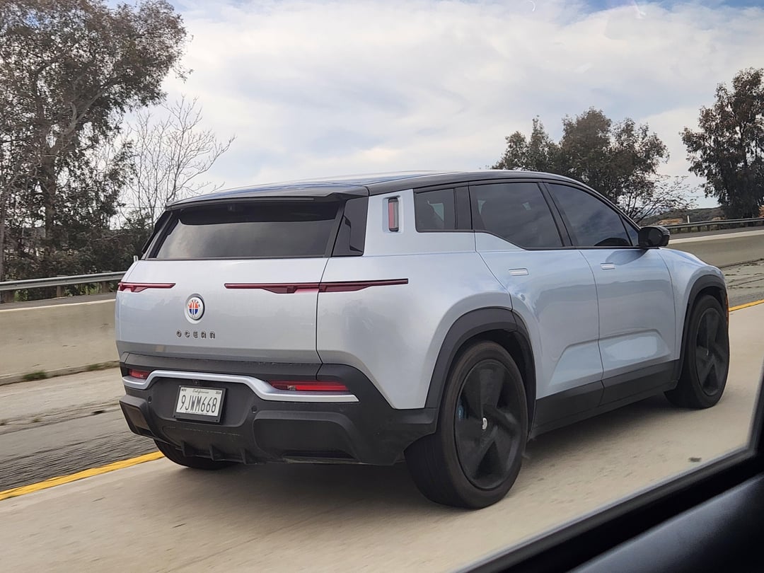 A company's first car and their newest car rollin together [Fisker ...
