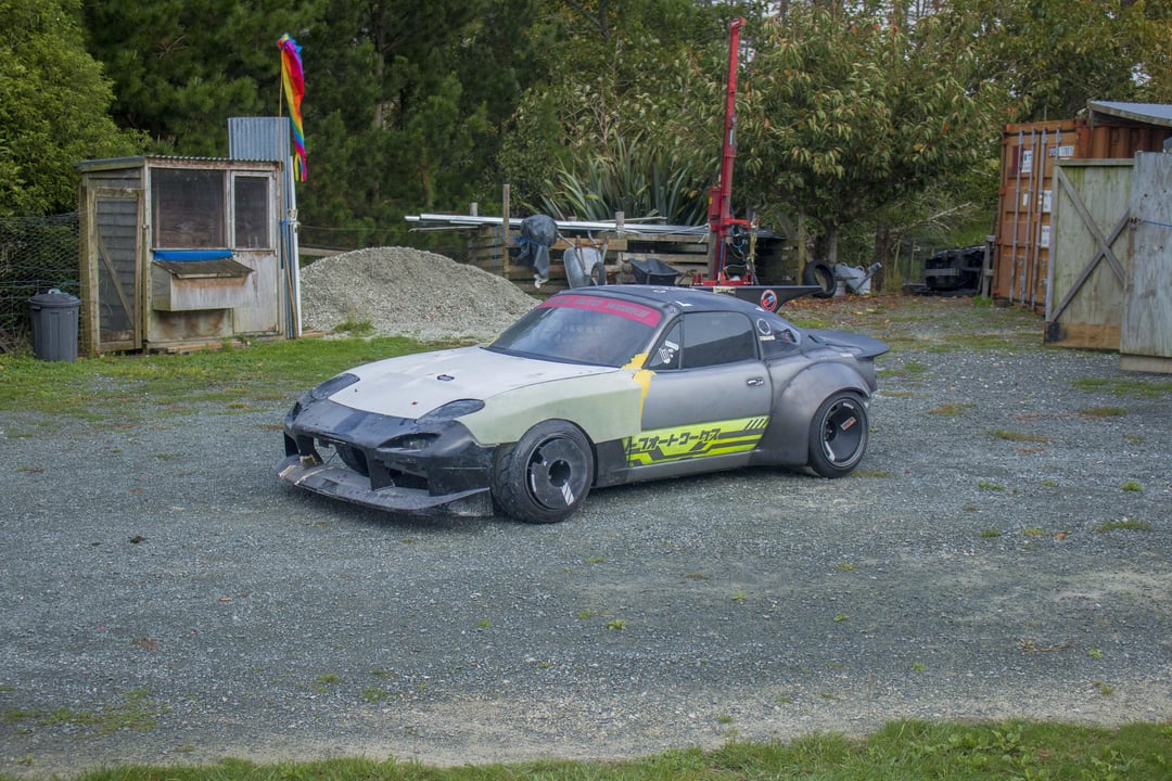 Finished up the custom widebody Rx7 front for my cyberpunk Miata build ...